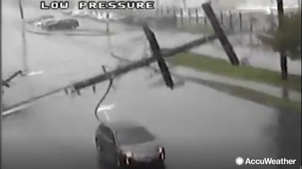 Dramatic video shows car hit by a pole as power lines fall | 9news.com