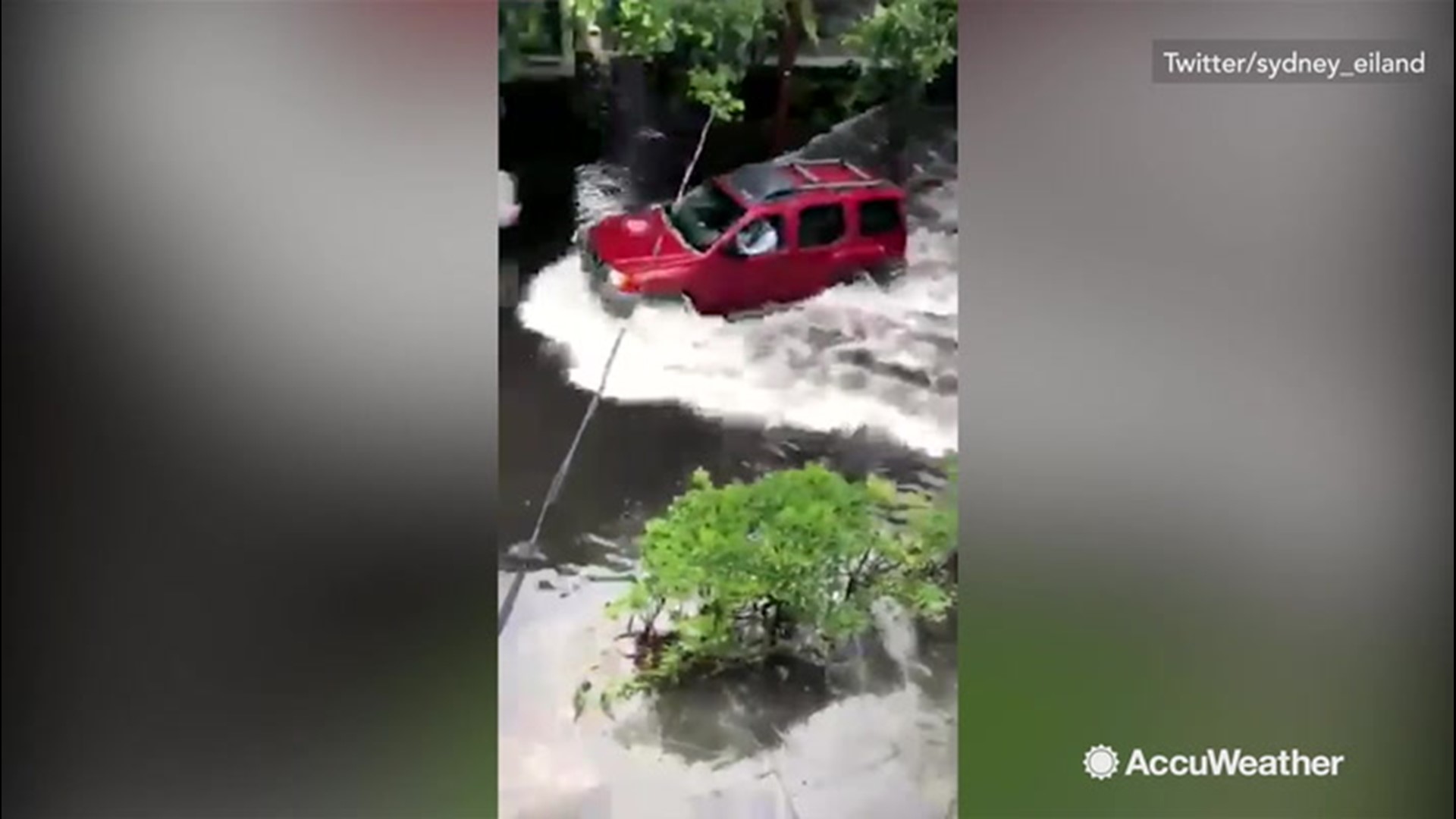 Cars make waves driving through streets covered in water | 9news.com