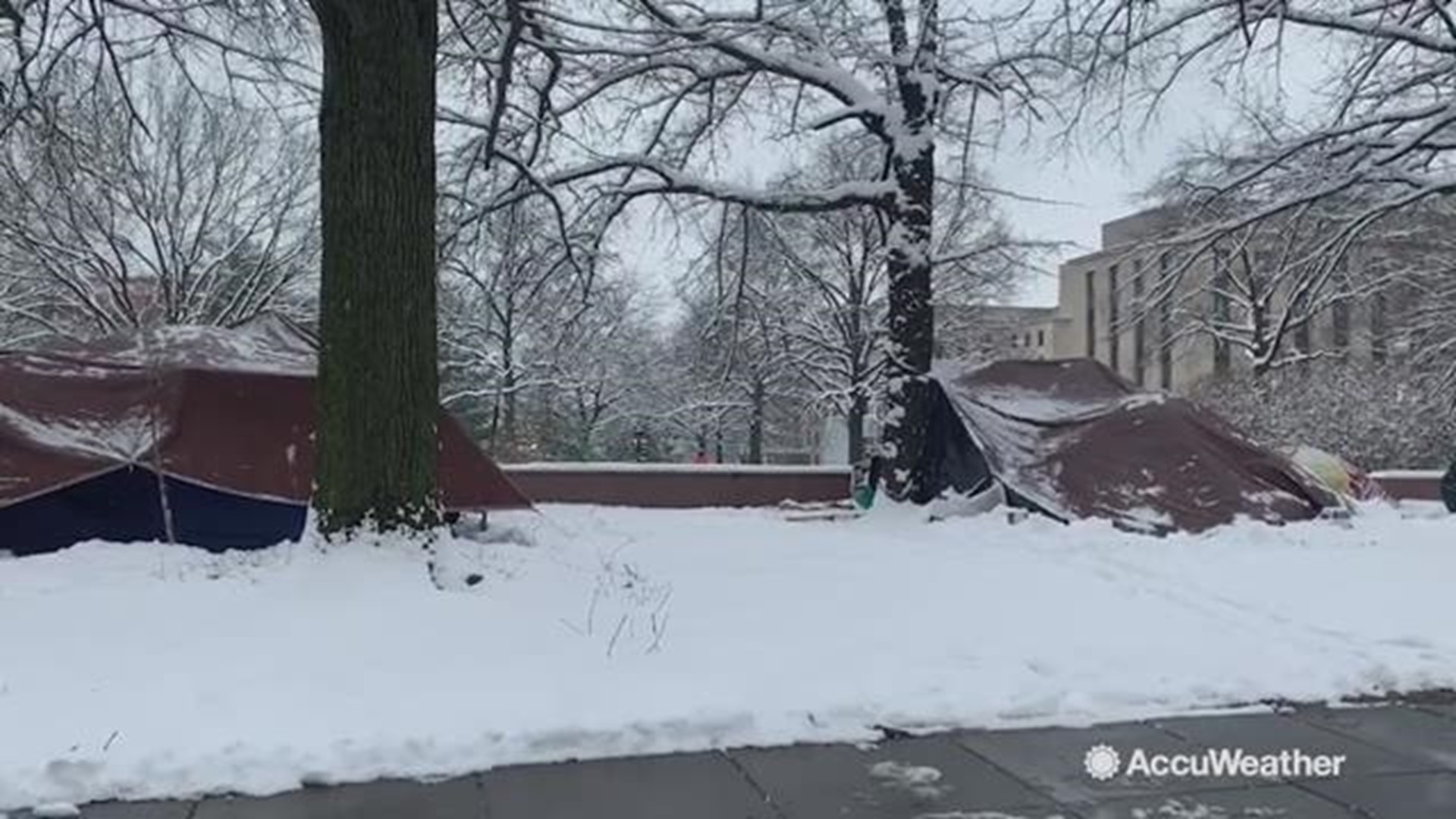 Winter storm leaves homeless tent city buried in snow | 9news.com