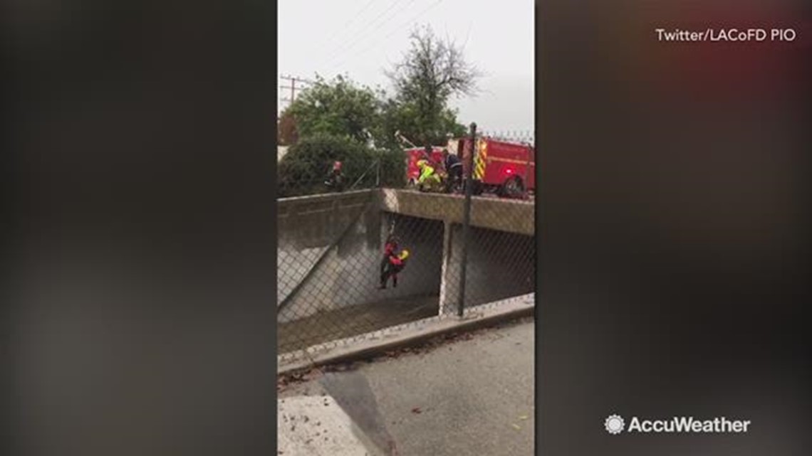 Dramatic swift water rescue from hazardous flood channel | 9news.com