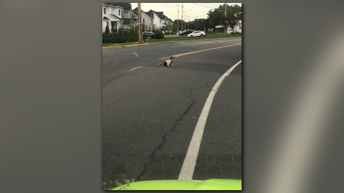 Baby crawls across New Jersey street in traffic in controversial viral ...