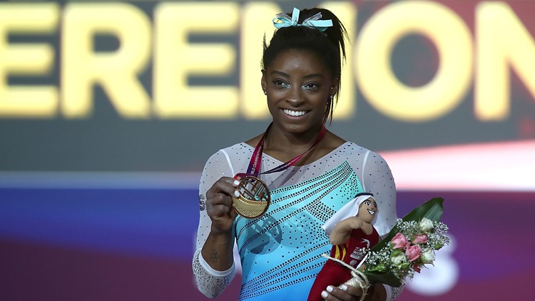 Simone Biles makes history as first woman to win 4 all-around world ...