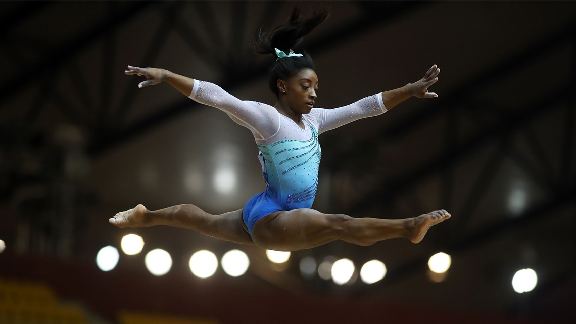 Simone Biles makes history as first woman to win 4 all-around world ...