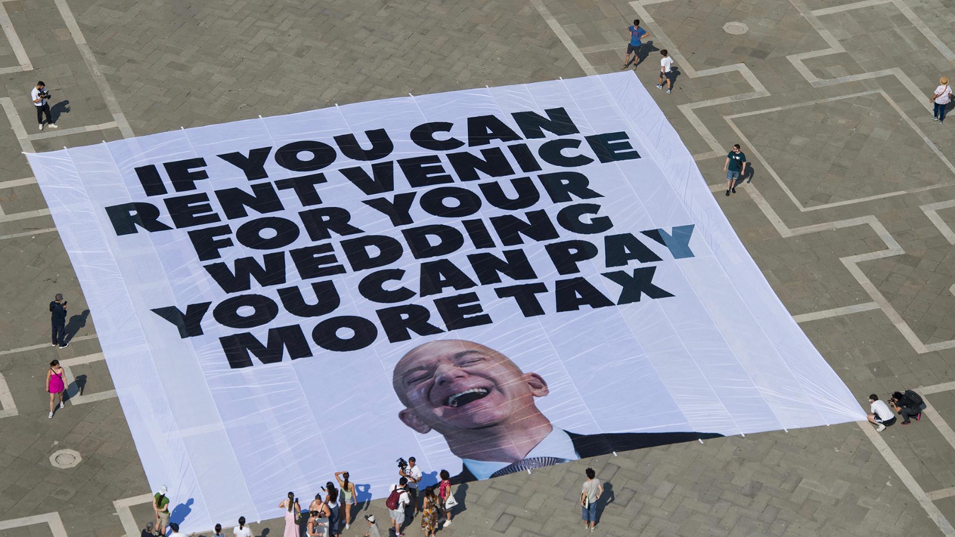 Activists protest Bezos' Venice wedding over income inequality | 9news.com