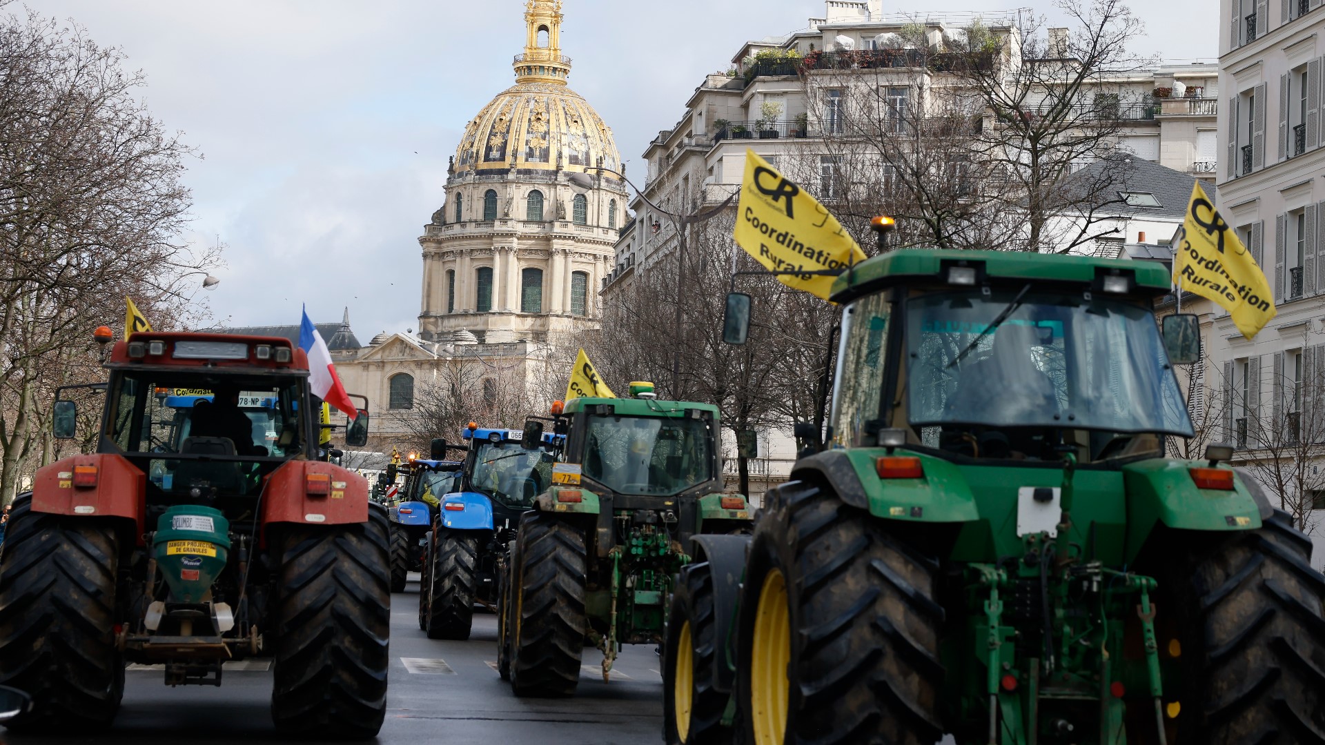 Farmers ride tractors through Paris, protesting lack of support | 9news.com