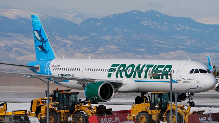 Frontier flight diverted after passenger tried to open door, choke off ...