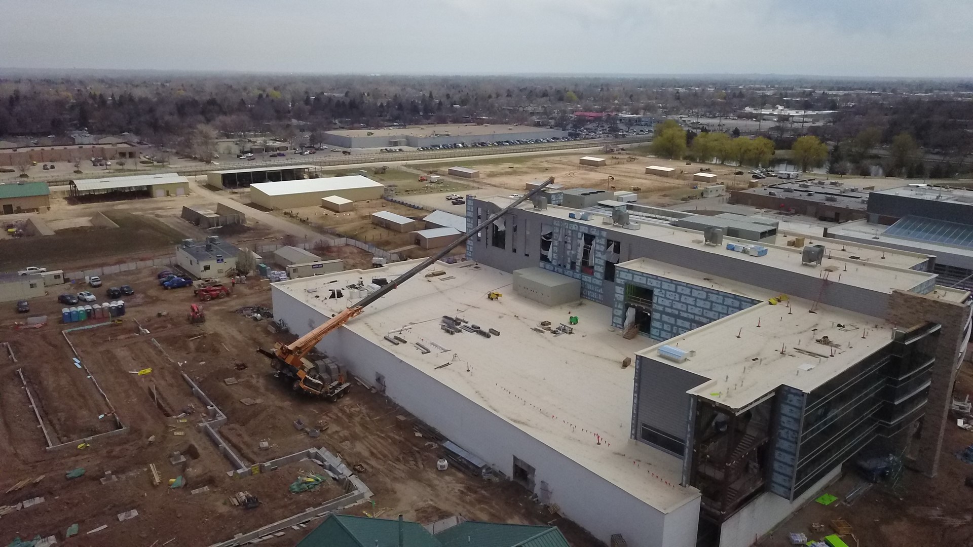 Crane tips over onto building at CSU | 9news.com