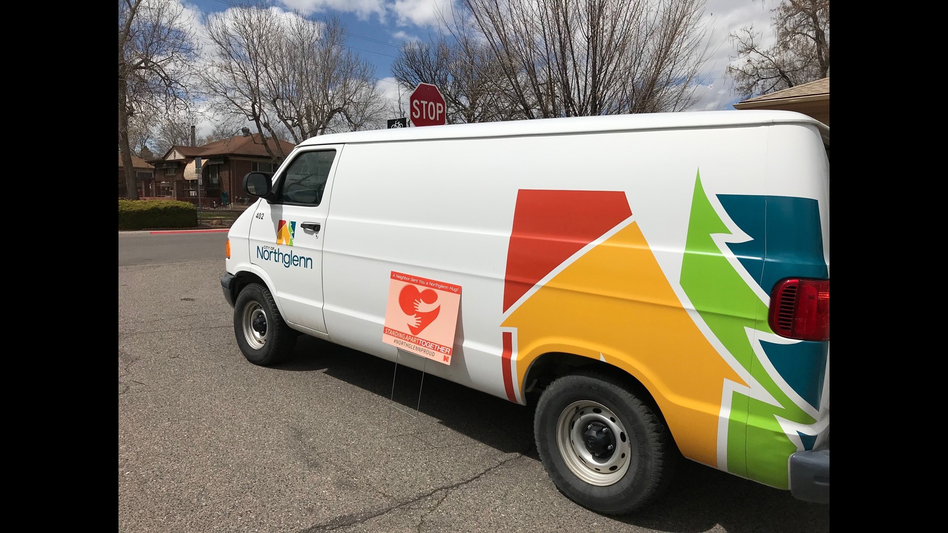 COVID-19: Northglenn giving out 'hug signs' to help spread joy | 9news.com