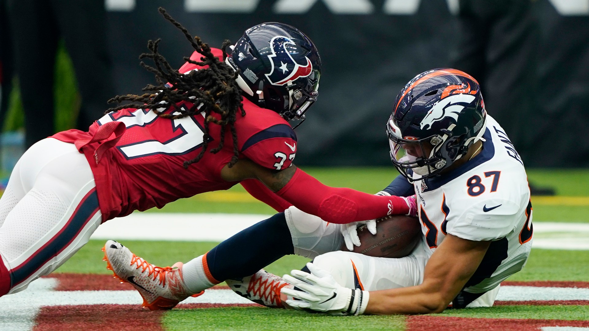 Lock shines in road debut, Broncos surprise Texans, 38-24 | 9news.com
