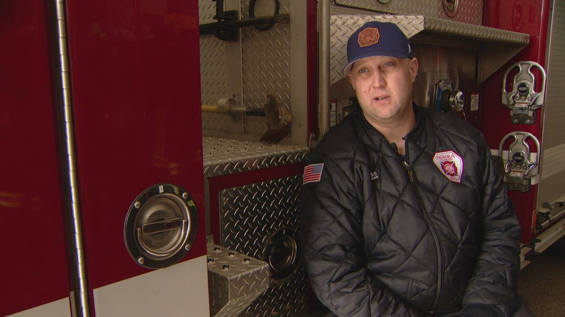 Firefighter rescues person stuck inside trash truck | 9news.com