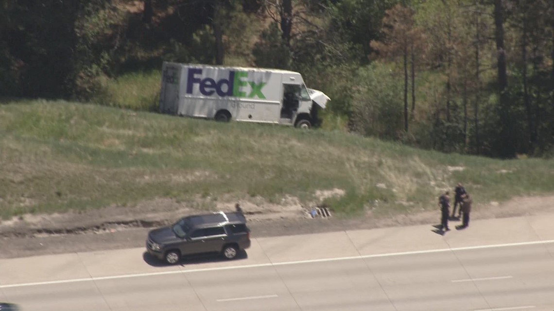 PHOTOS | Stolen FedEx crashes on side of I-25 | 9news.com