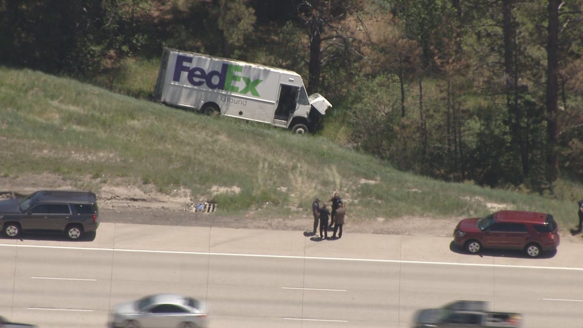 PHOTOS | Stolen FedEx crashes on side of I-25 | 9news.com
