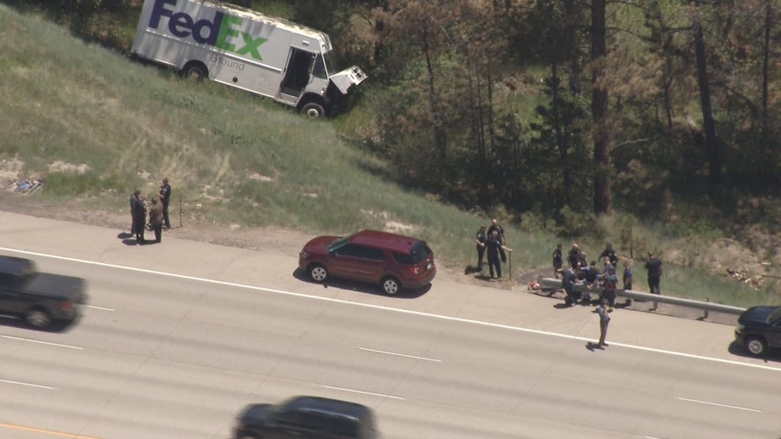 PHOTOS | Stolen FedEx crashes on side of I-25 | 9news.com