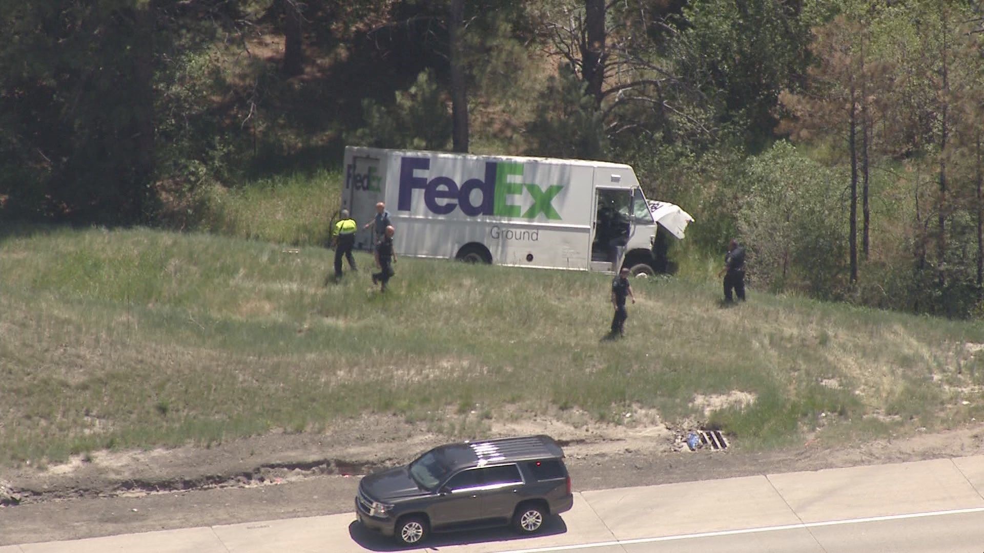 PHOTOS | Stolen FedEx crashes on side of I-25 | 9news.com