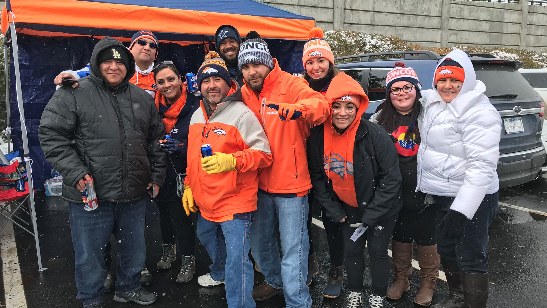 Hearty Broncos fans tailgate despite snow, freezing temps | 9news.com