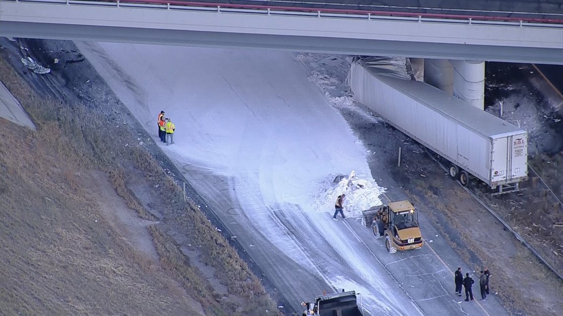 Cleanup continues into afternoon after semi hit bridge on E-470 | 9news.com