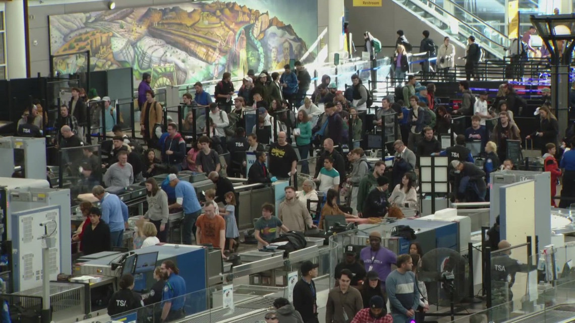 Travelers pack DIA during busy holiday season | 9news.com