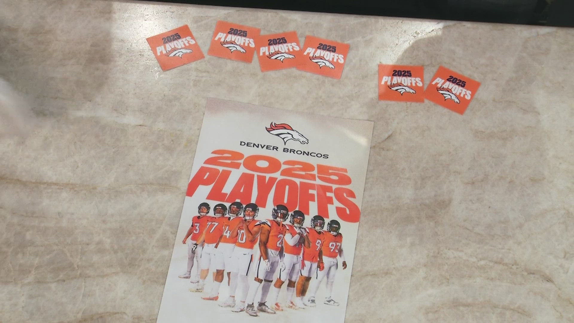 Broncos giving away free playoff posters and decals | 9news.com