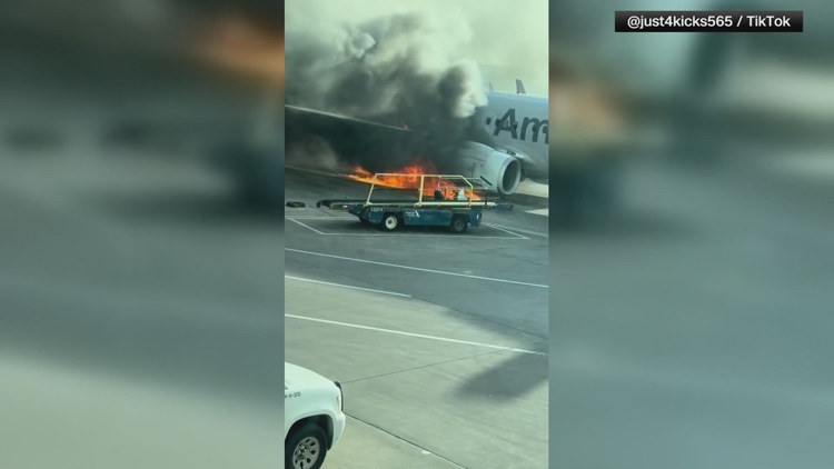 American Airlines plane catches fire at Denver airport gate | 9news.com