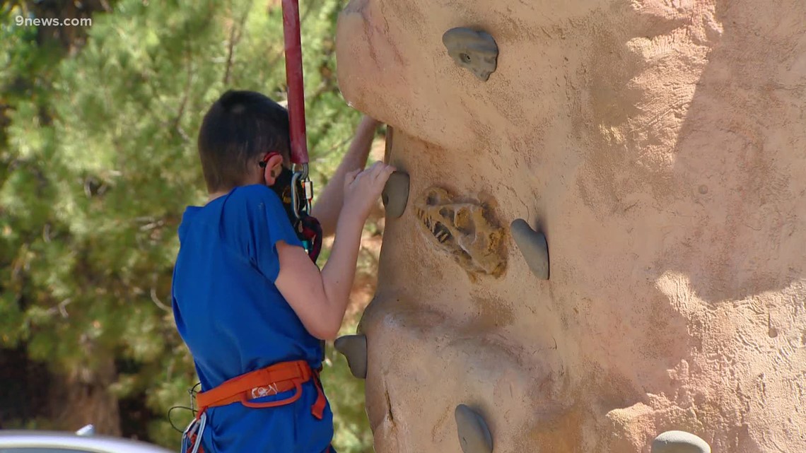 Climbing group brings mobile climbing wall to autistic children | 9news.com