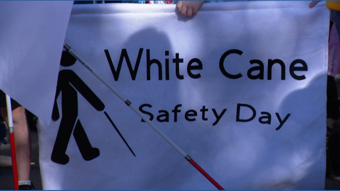 Denver students honor White Cane Day with community walk | 9news.com