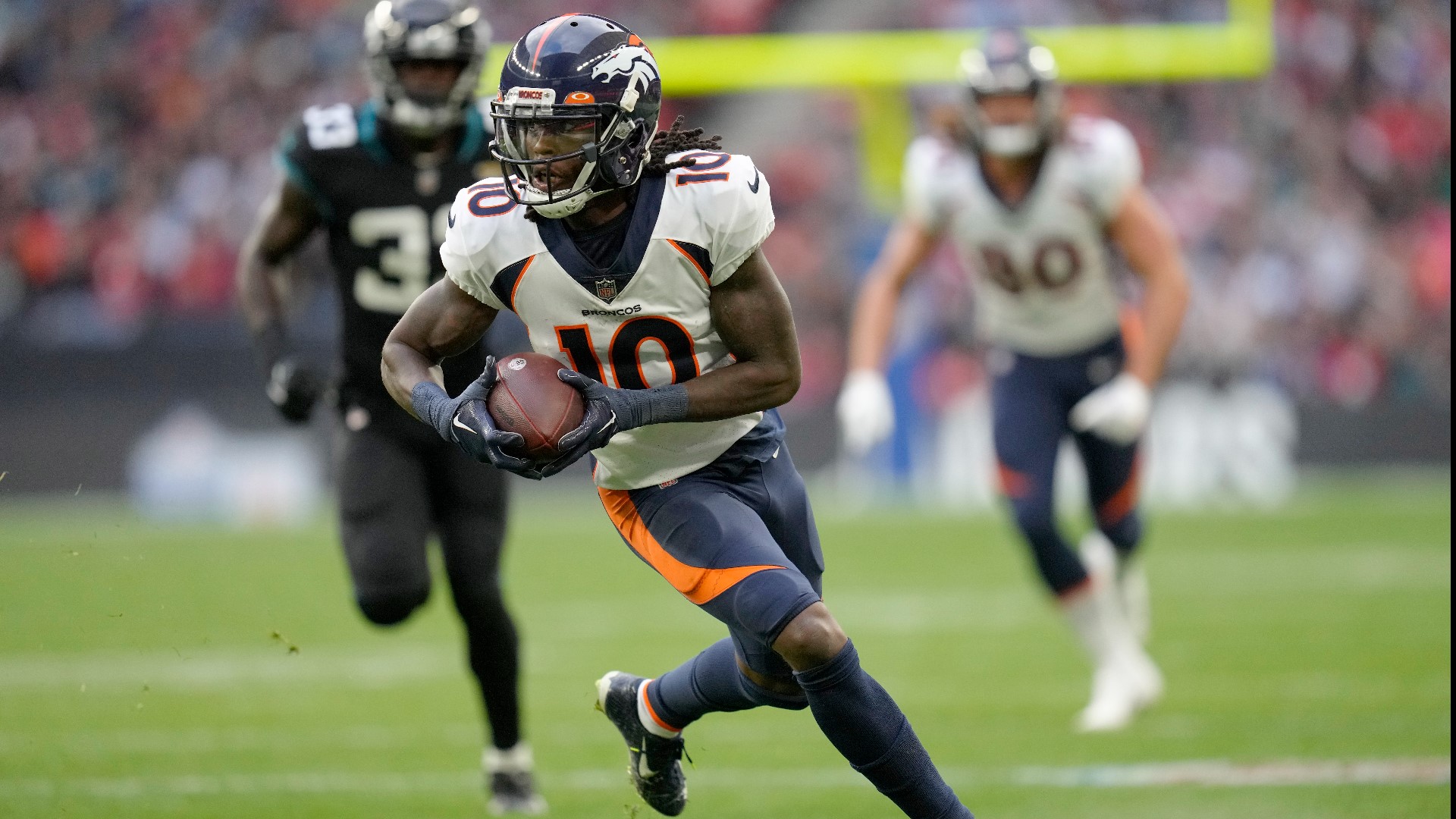 Denver Broncos orange-blue stripe uniform combo returns vs Titans ...