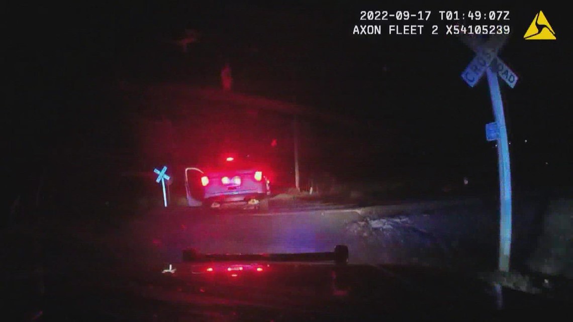 Woman left in patrol car, hit by train, faces felony charge | 9news.com