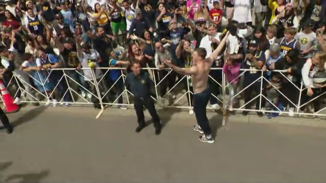 Christian Braun jumps from firetruck to celebrate with Nuggets fans ...