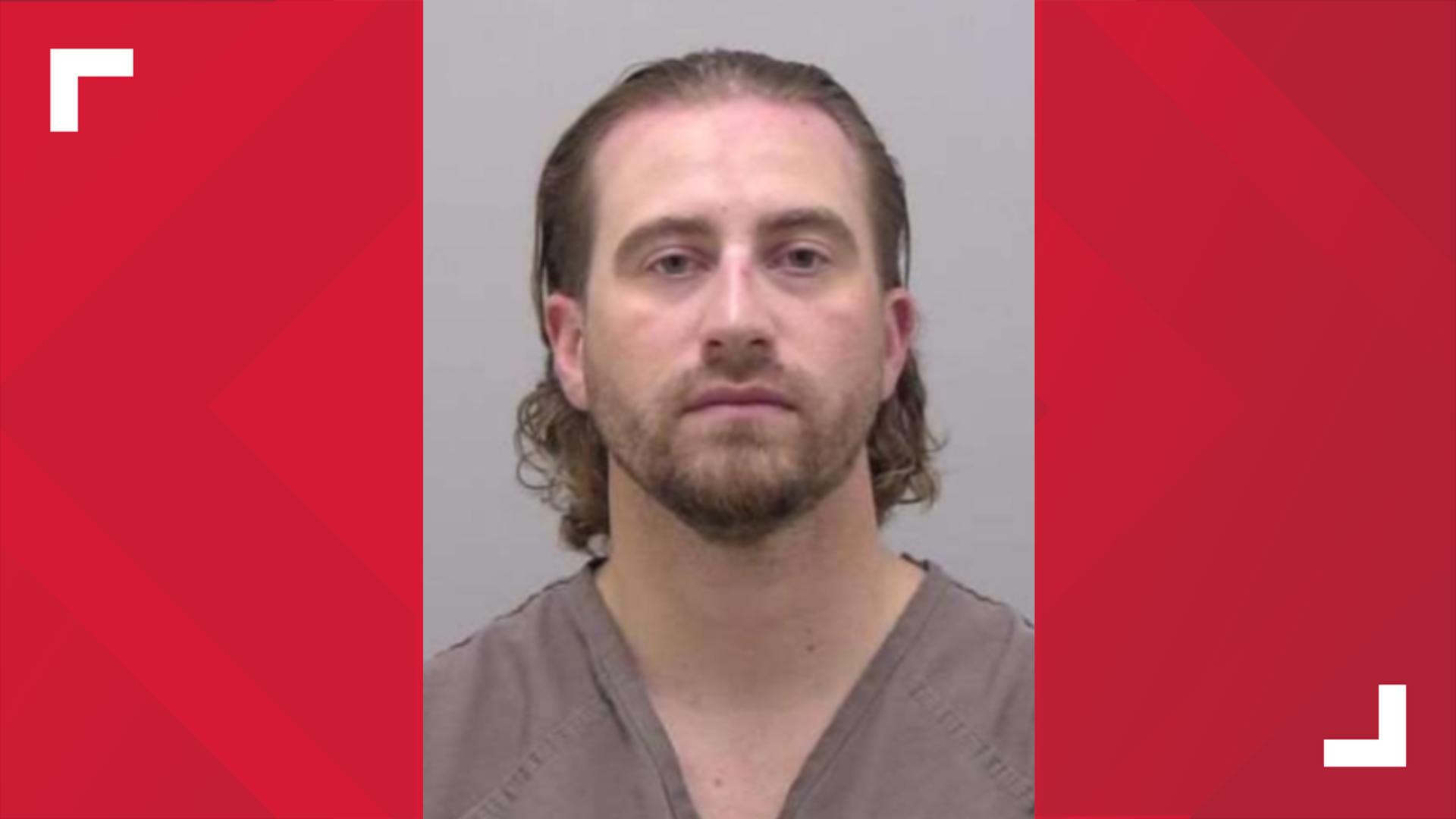 DPD officer arrested on domestic violence charges | 9news.com