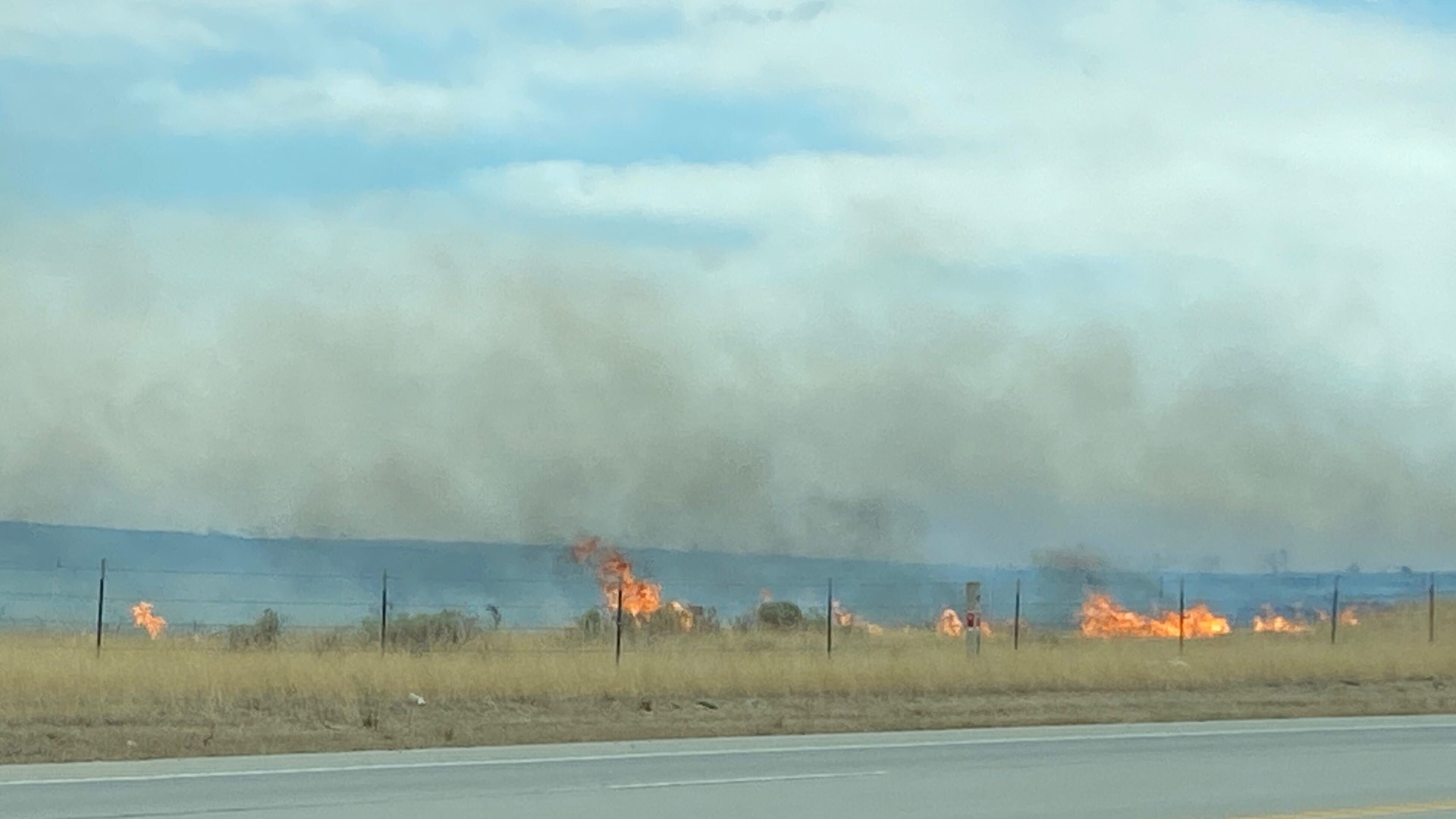 Multiple agencies respond to large grass fire north of Hudson | 9news.com