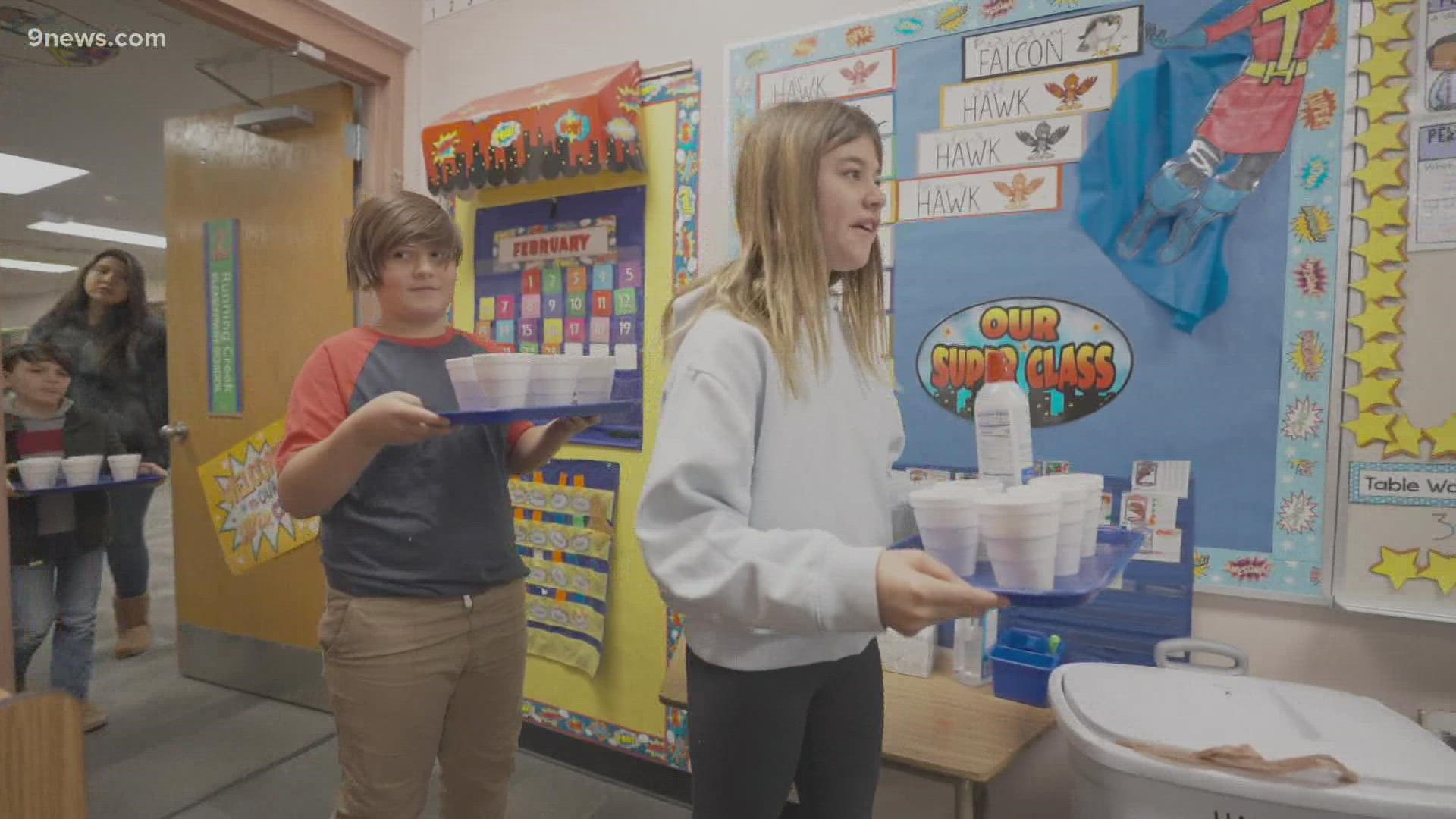 Elementary class selling cups of hot cocoa to help buy plants for ...