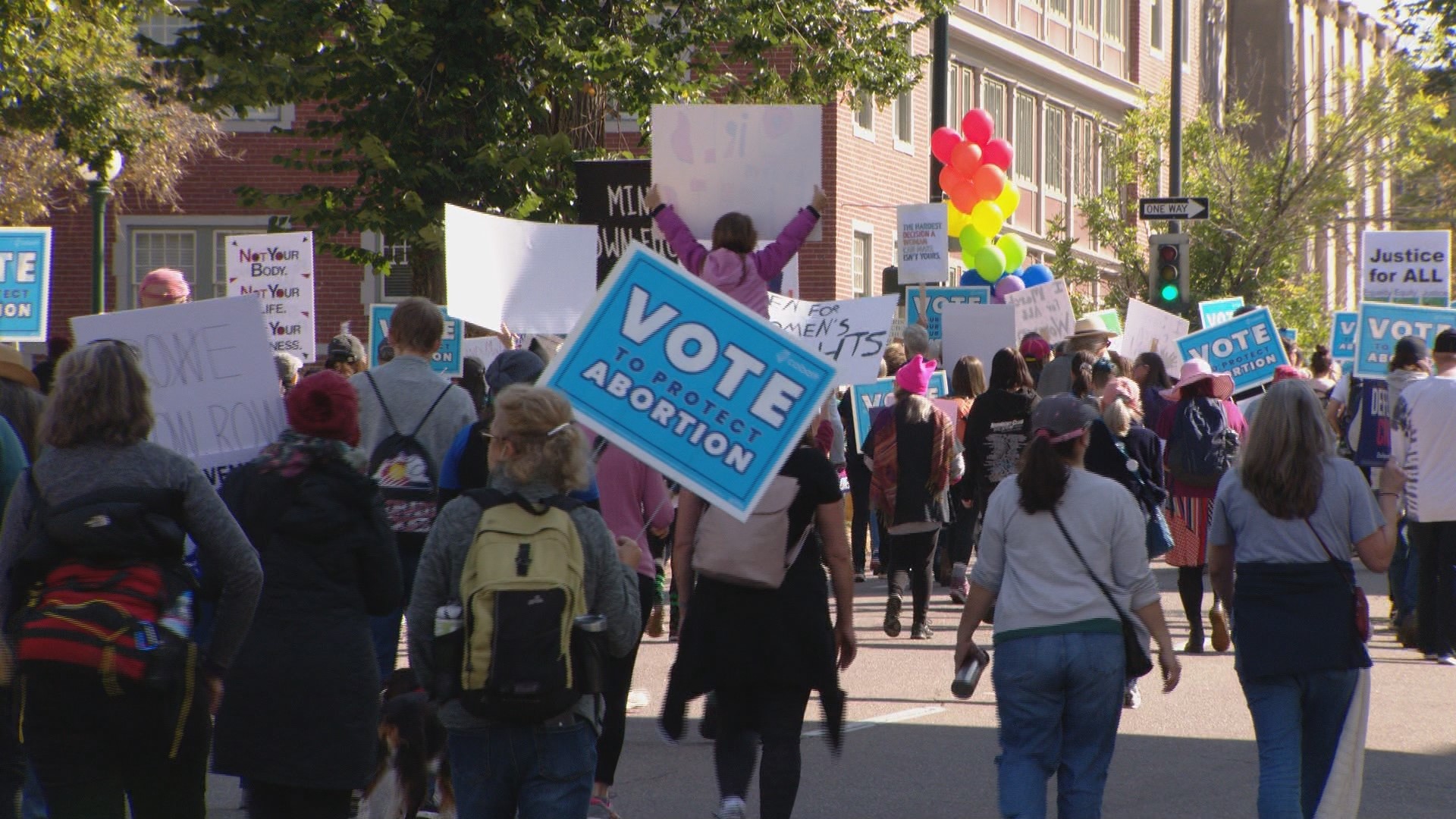 Women's march held in Denver, Boulder ahead of upcoming election ...