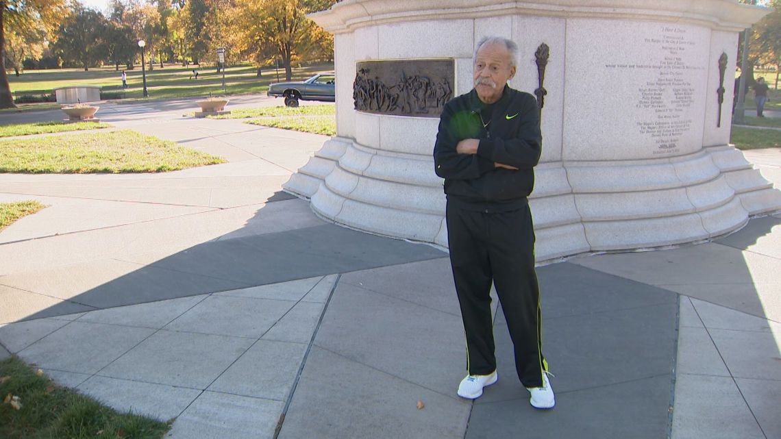 Sculptor Ed Dwight repairs vandalism to Denver MLK monument | 9news.com