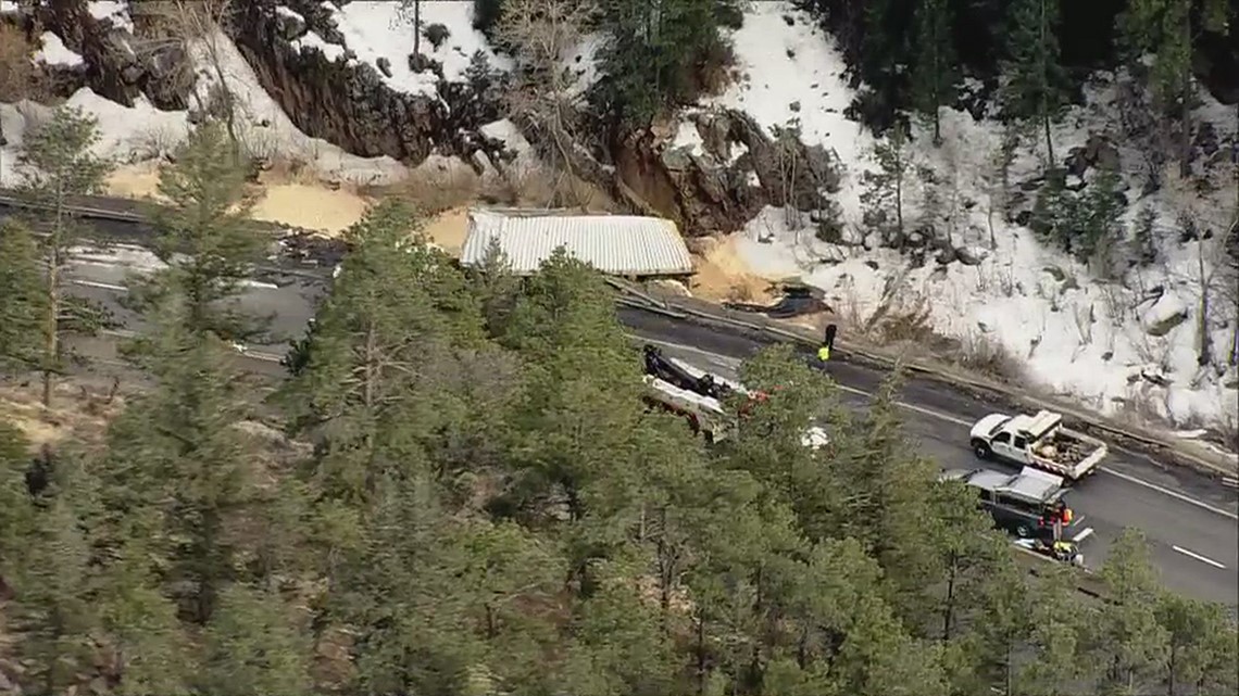 RAW: Semi crashes over embankment, causes highway closure | 9news.com