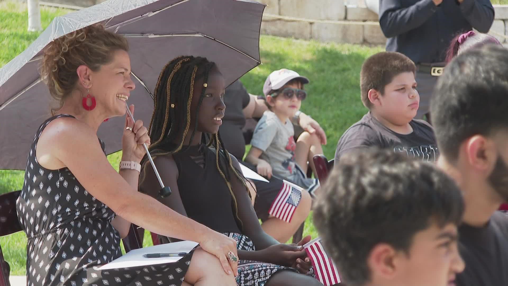 64 kids in Denver become U.S. citizens | 9news.com