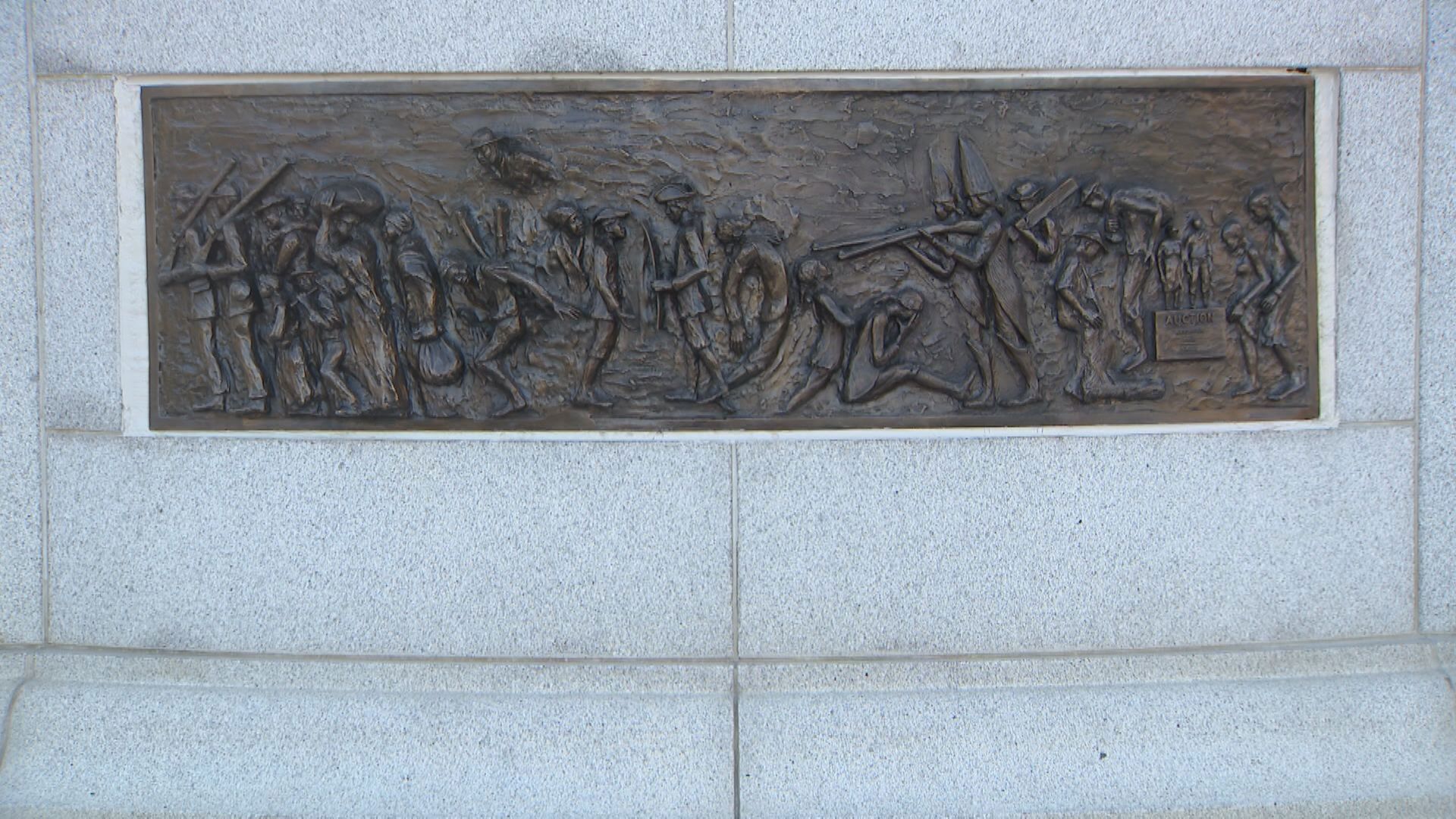 Sculptor Ed Dwight repairs vandalism to Denver MLK monument | 9news.com