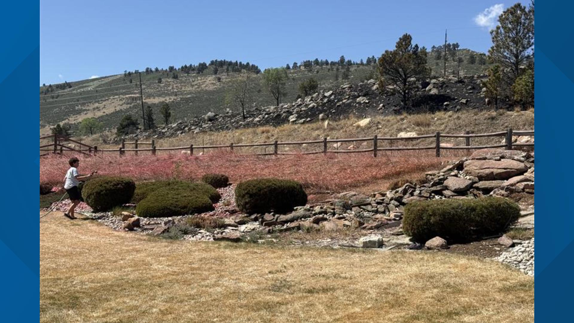 Red sludge in yards shows how close Ponds Fire got to homes | 9news.com