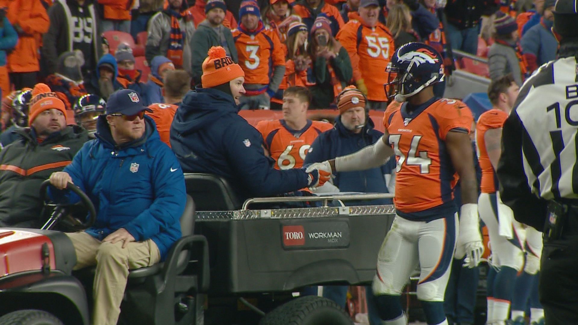 Denver Broncos security guard breaks ankle tacking fan | 9news.com