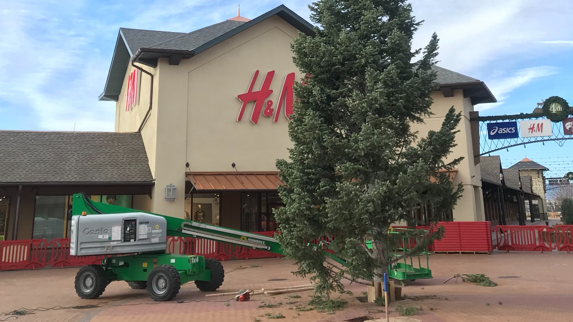 Outlets at Castle Rock trims 55-foot white fir Christmas tree | 9news.com