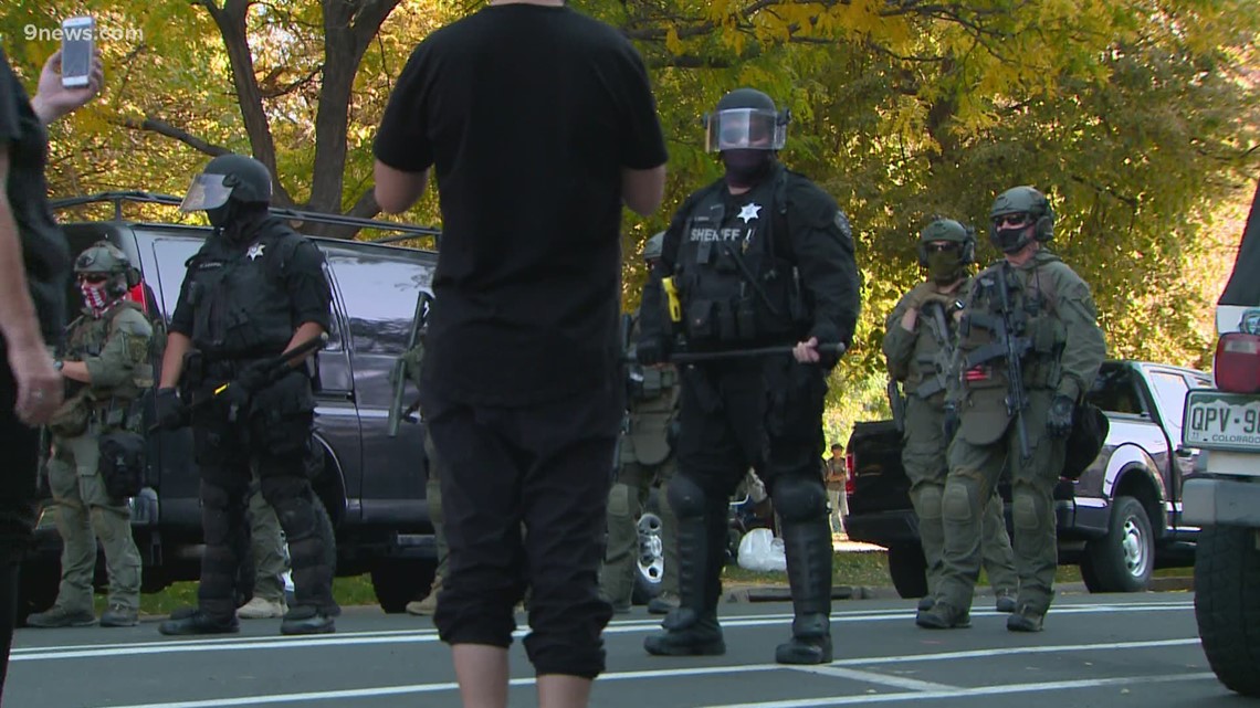 1 dead, security guard in custody after shooting near dueling Denver ...