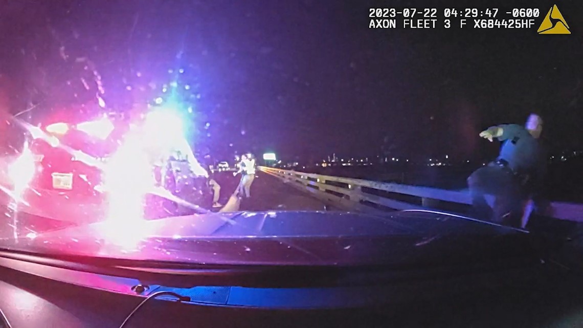 RAW: Video shows state trooper forced over bridge barrier while ...