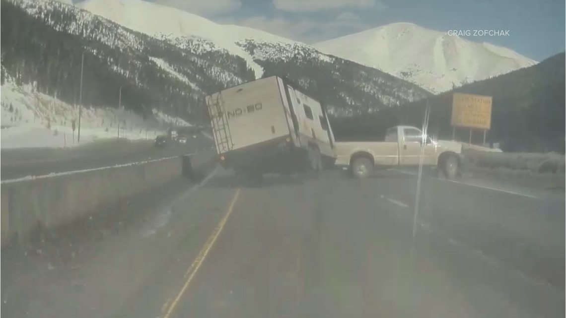 Terrifying video shows truck, trailer crash after hitting pothole ...