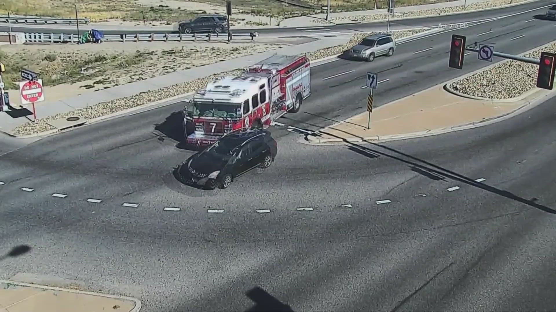 Driver crashes into Aurora firetruck, injuring 3 firefighters | 9news.com