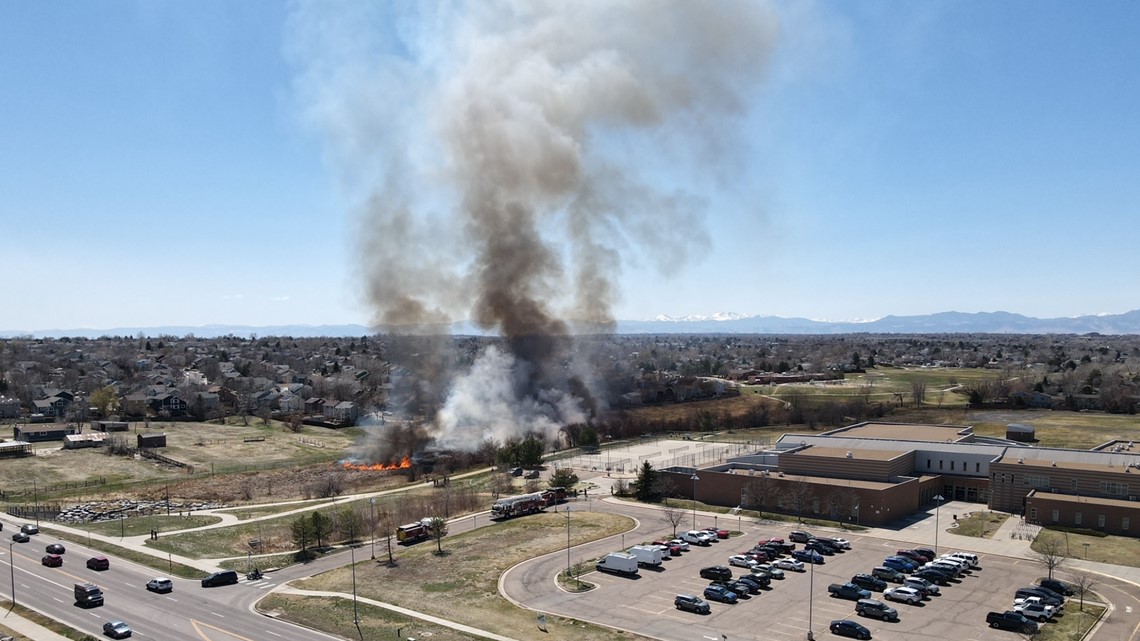 Grass fire burns near Shadow Ridge Middle School | 9news.com