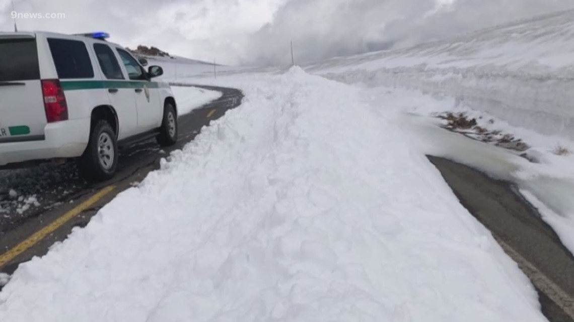 Deep snow drifts close Trail Ridge Road in Rocky Mountain National Park ...