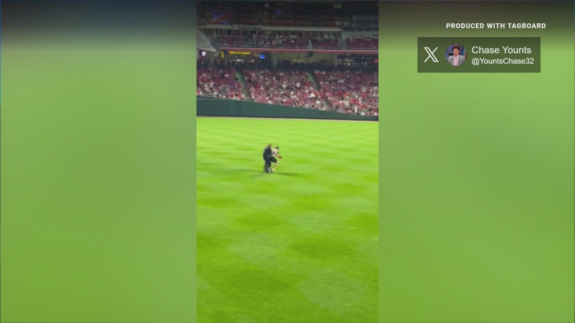 Fan runs onto field, does backflip during Cincinnati Reds game | 9news.com