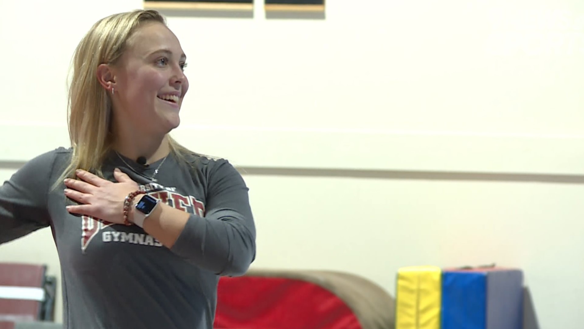 Mia Sundstrom volunteer coach University of Denver gymnastics | 9news.com