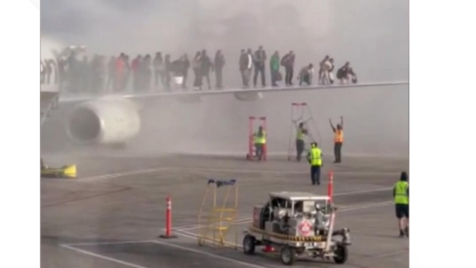 American Airlines plane catches fire at Denver airport gate | 9news.com