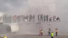 American Airlines plane catches fire at Denver airport gate | 9news.com