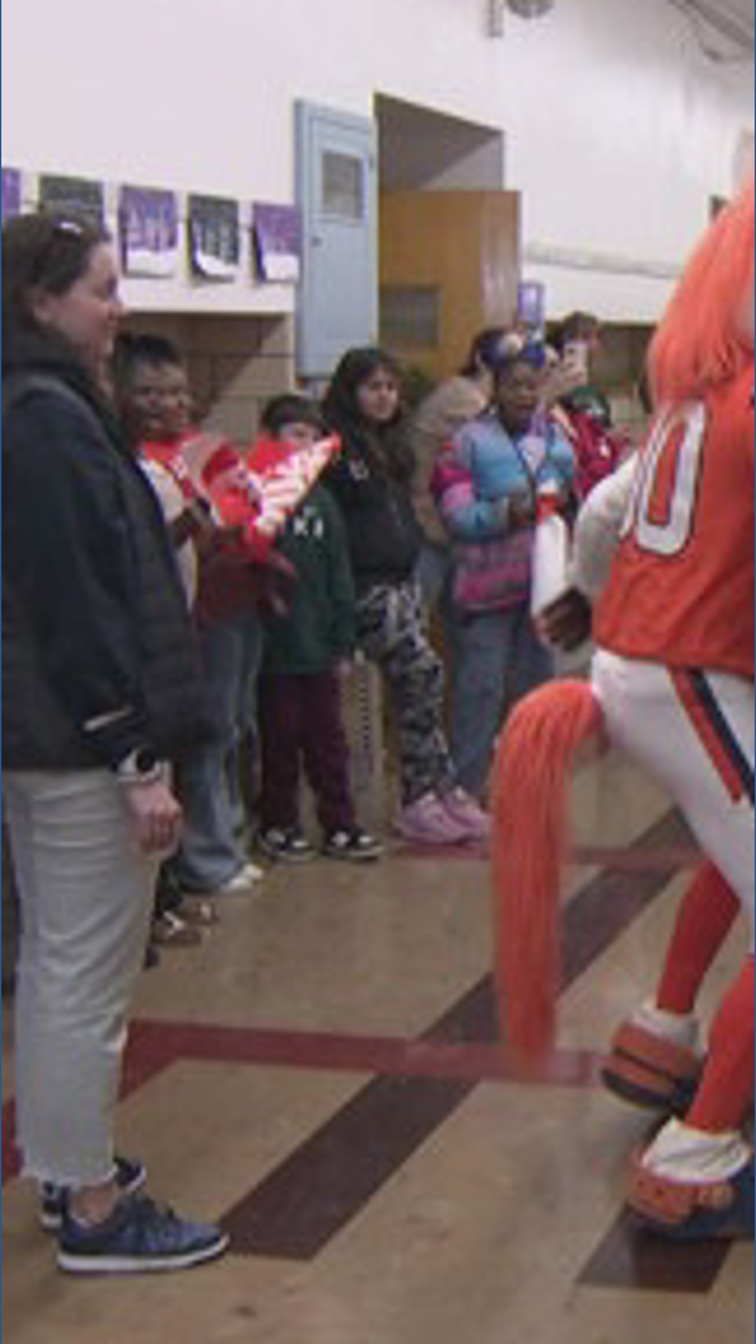 Elementary school fans celebrate with special Broncos visitors | 9news.com